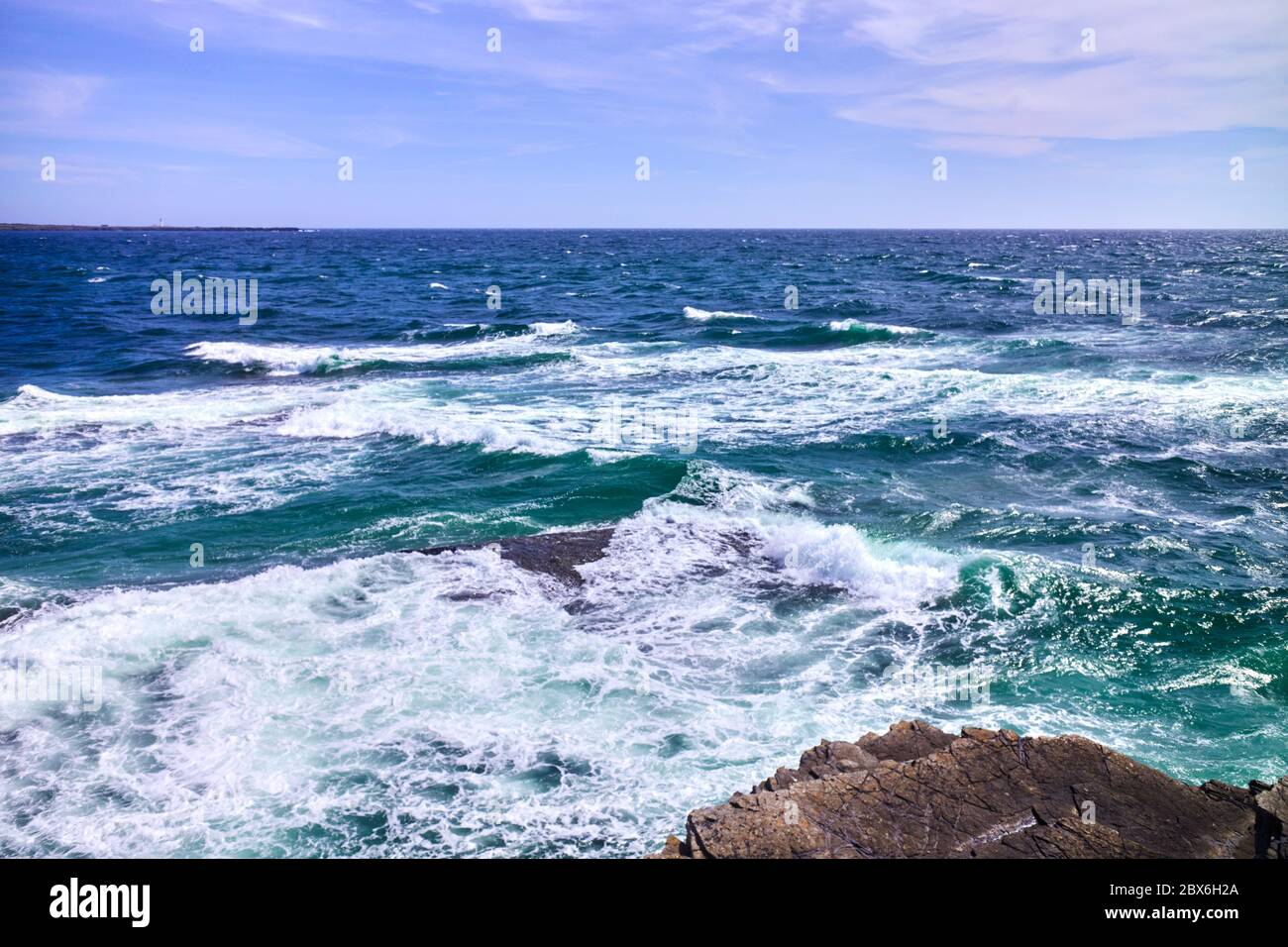 Large waves with white breakers in Castletown Bay overlooking the Irish ...