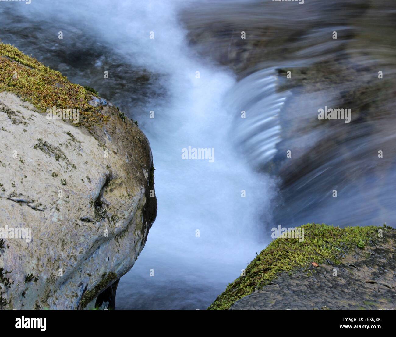 Water flowing over rocks Stock Photo - Alamy