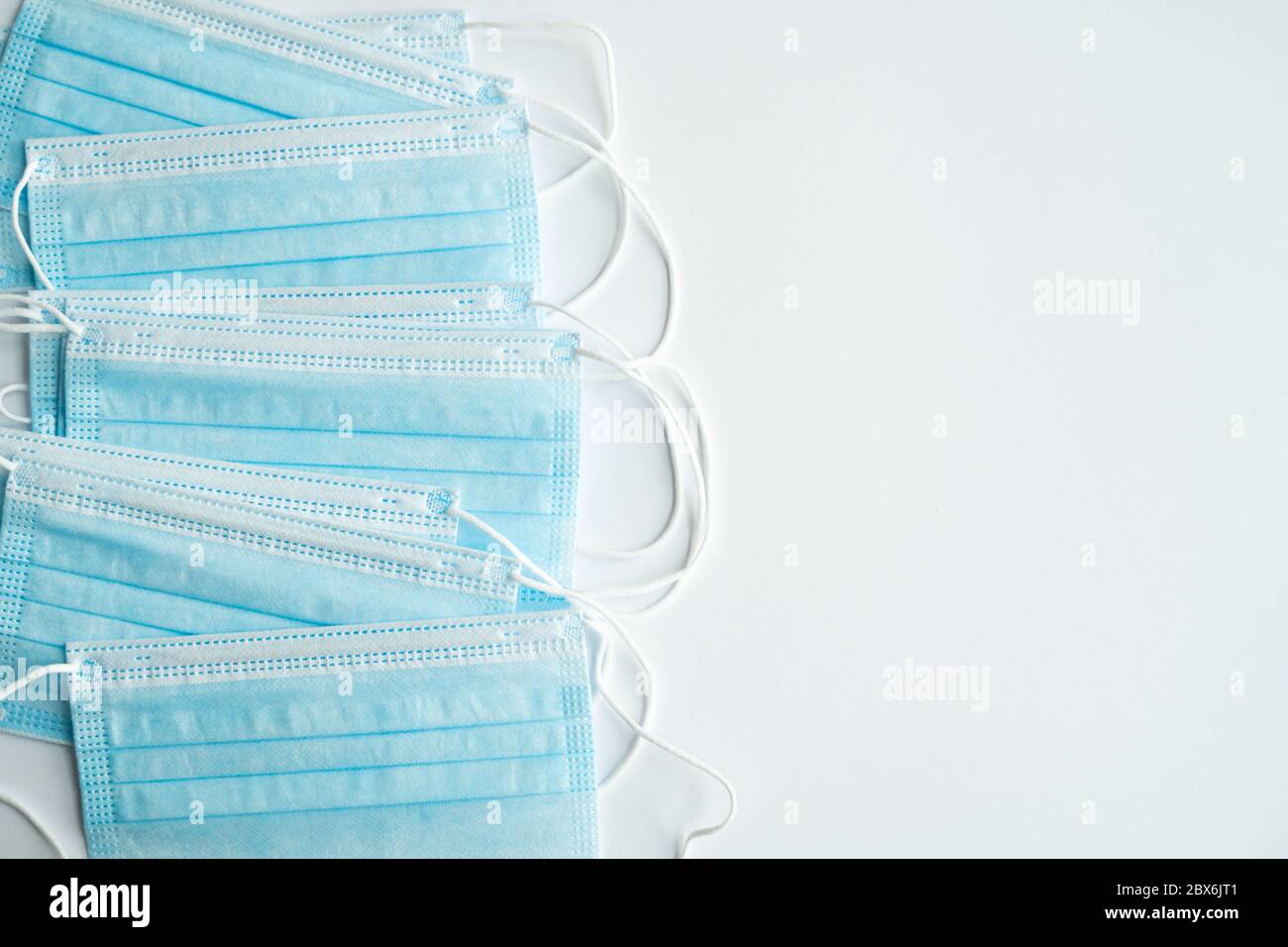 Medical protective masks on a gray background. Disposable 3-ply medical ...