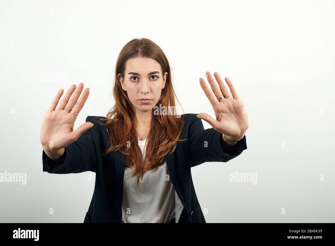 pulls hand forward camera, says no, disagrees, frowns face, gives ...