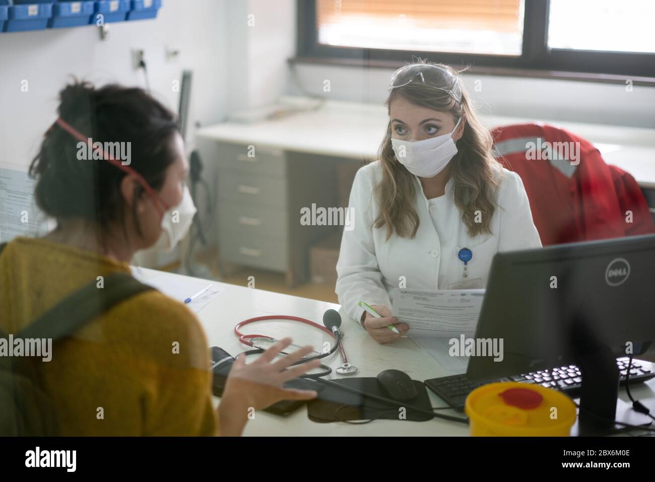 Hospital staff working with protection mask Stock Photo - Alamy