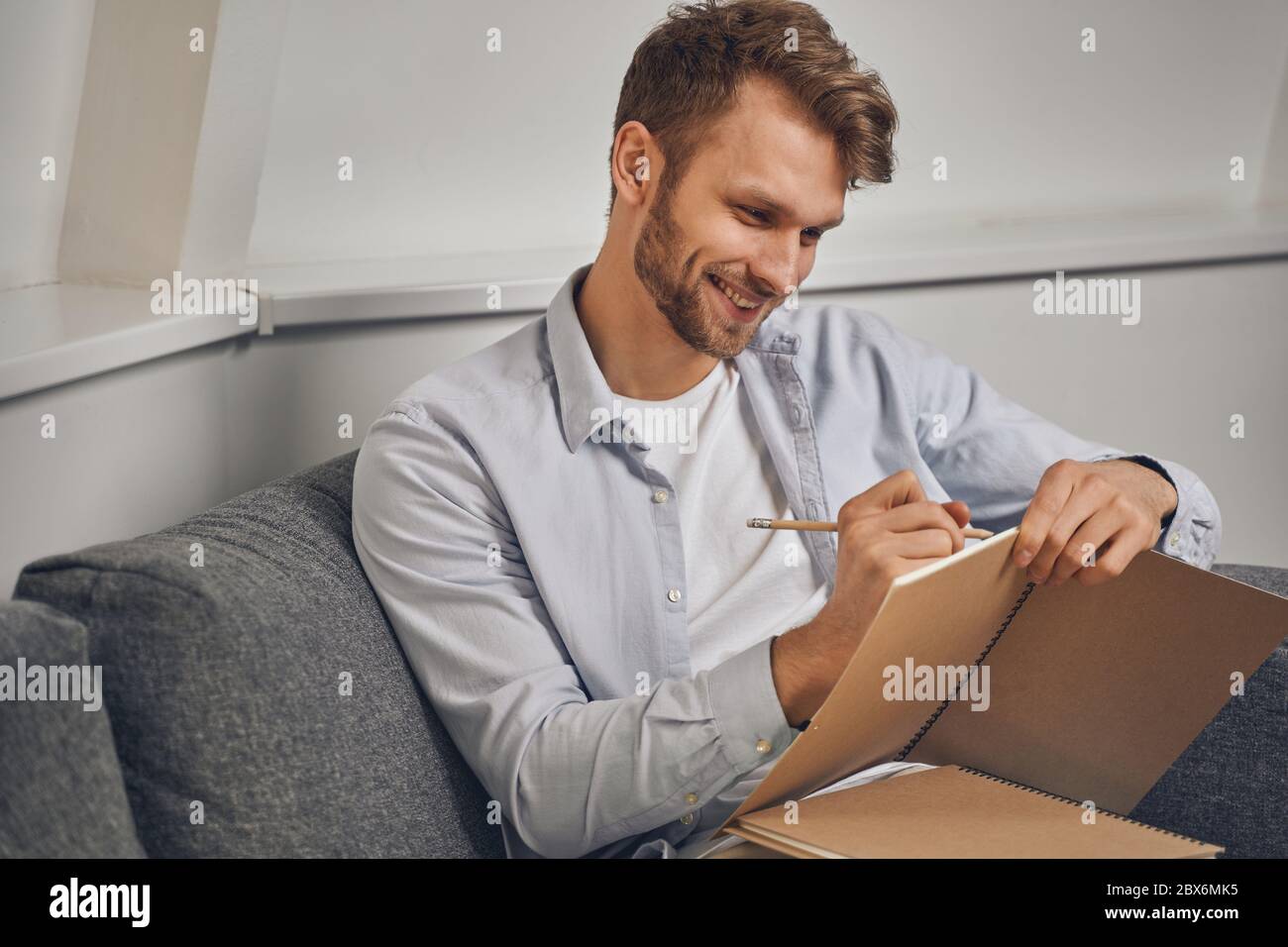 Focused employee taking notes hi-res stock photography and images - Alamy