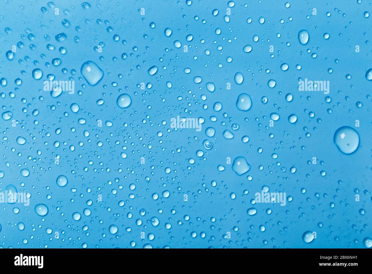 Rain droplets on blue glass background, Water drops on blue glass Stock ...