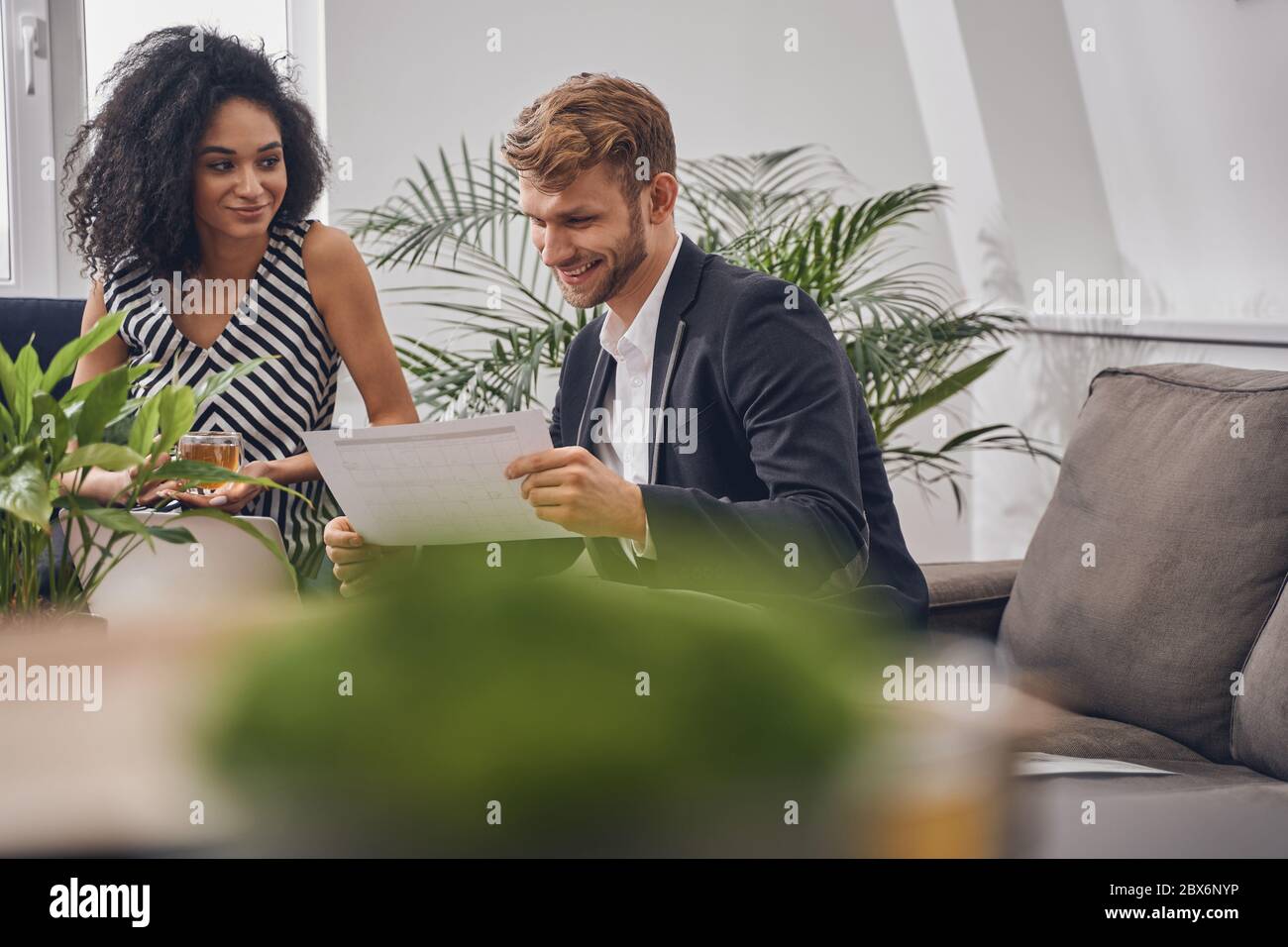 Woman looking through papers hi-res stock photography and images - Alamy