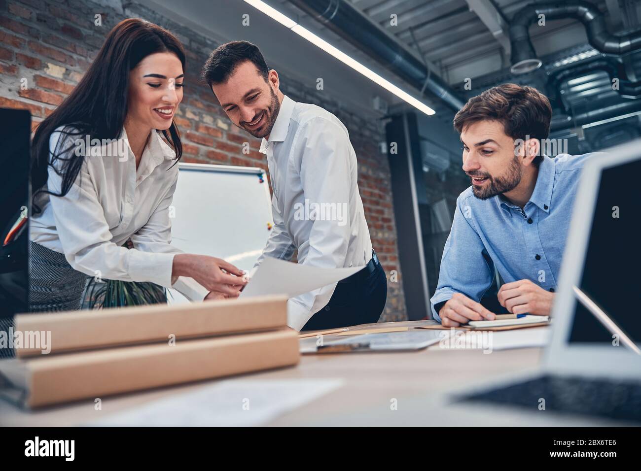 Teammates talking hi-res stock photography and images - Alamy