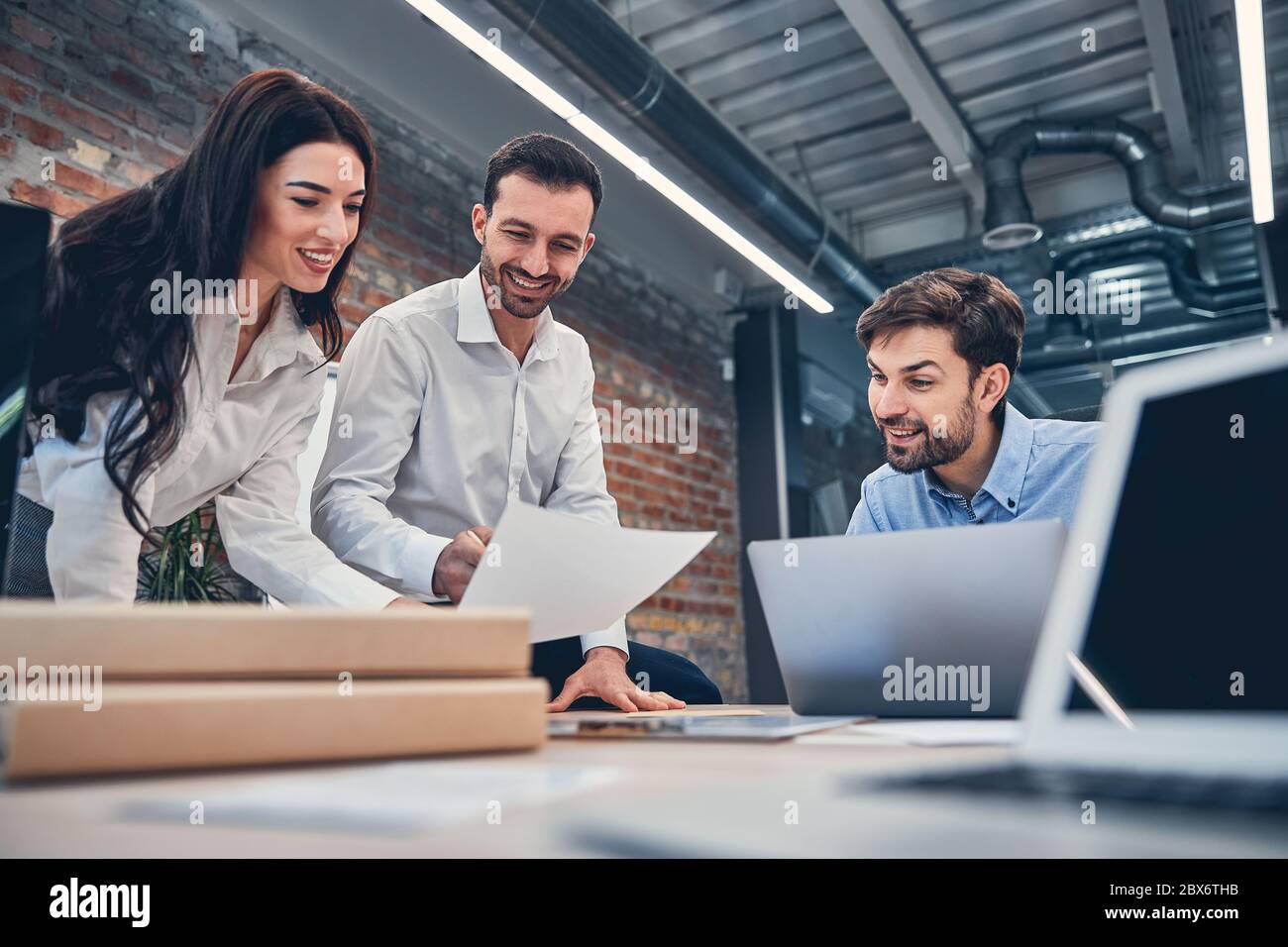Happy woman showing documents hi-res stock photography and images - Alamy