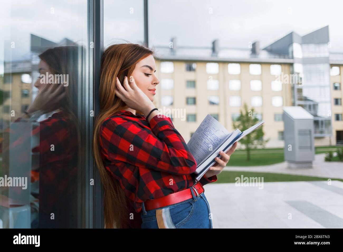 Female student repeats reading a notebook before an exam Stock Photo ...