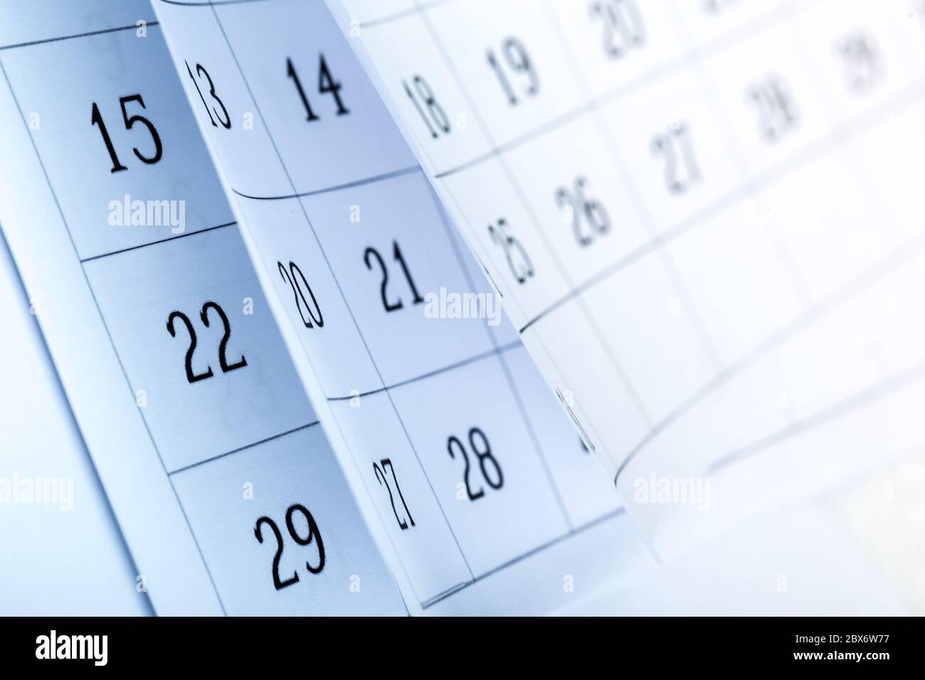 Closes a calendar page in blue. flipping calendar 2020 Stock Photo - Alamy