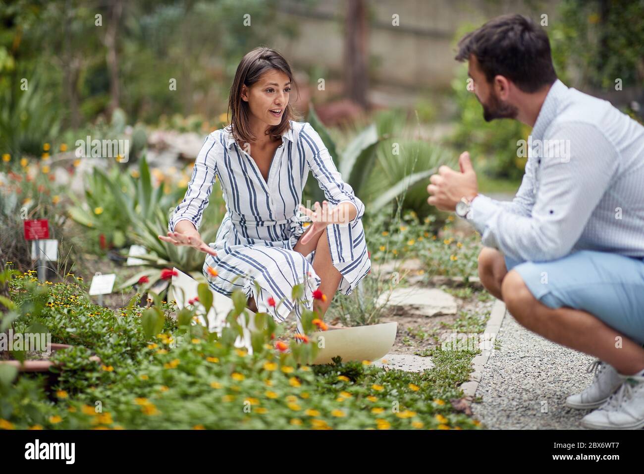 exited female landscape architect explaining new ides to a male ...