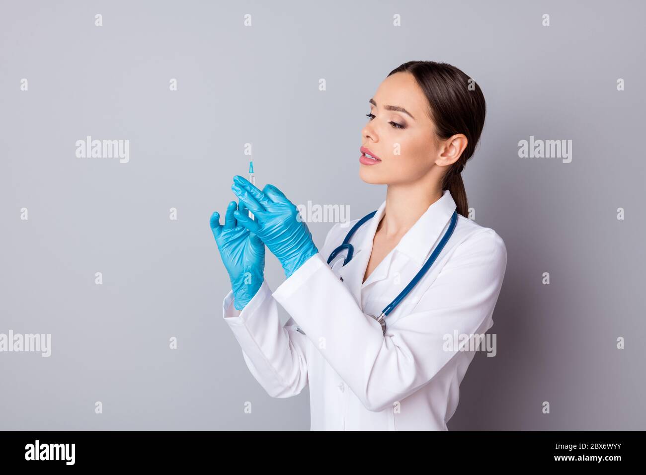 Photo of professional doc serious nurse hold prepare syringe patients ...