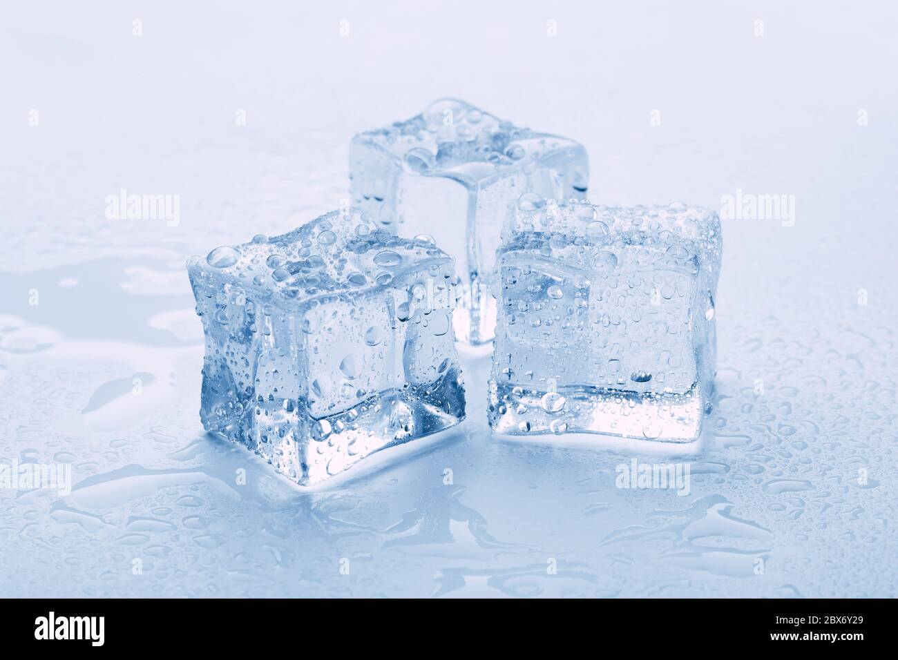 Melted ice cubes close up isolated on white background Stock Photo - Alamy