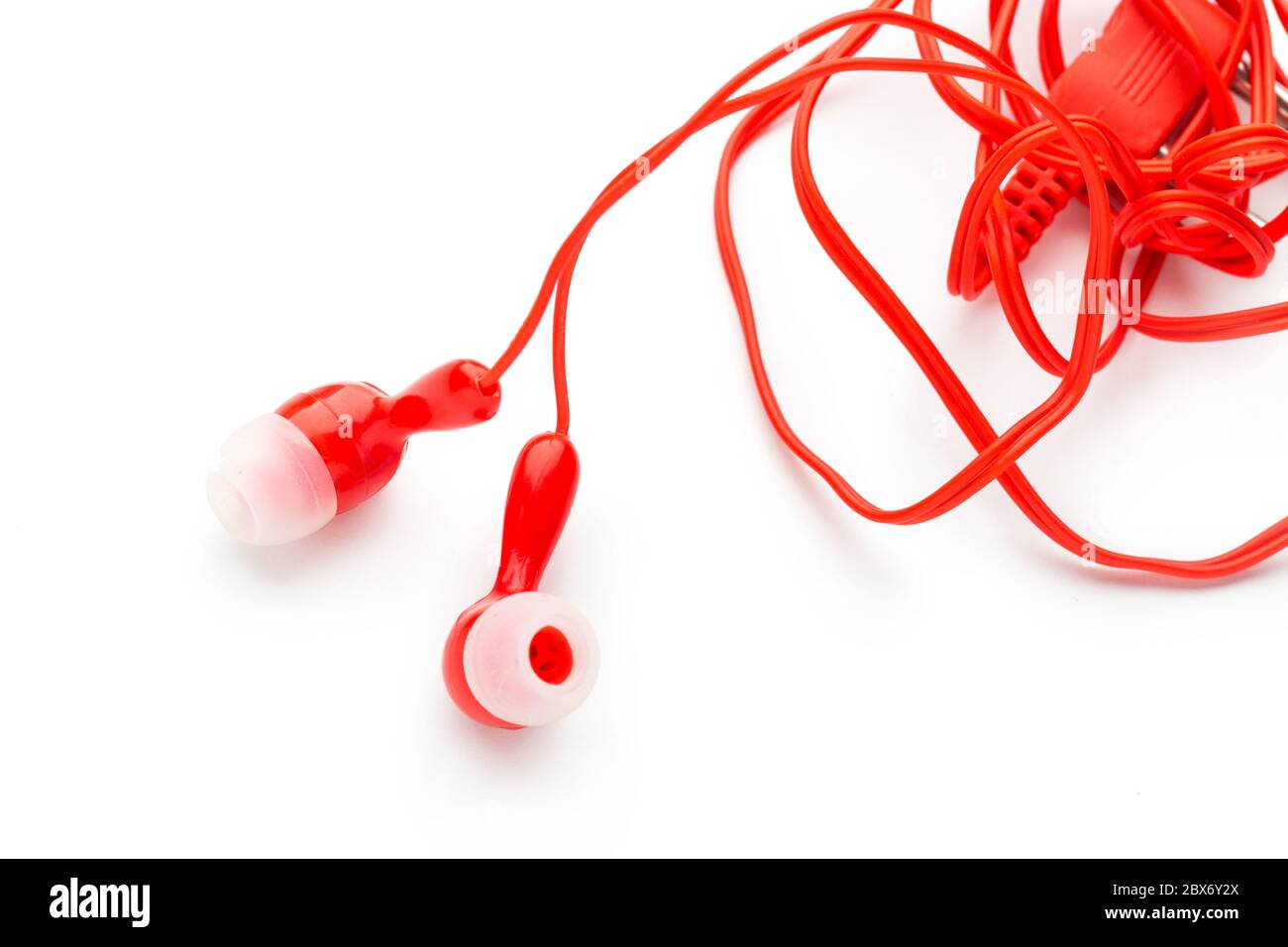 Modern wired classic red headphones isolated on white Modern technology ...