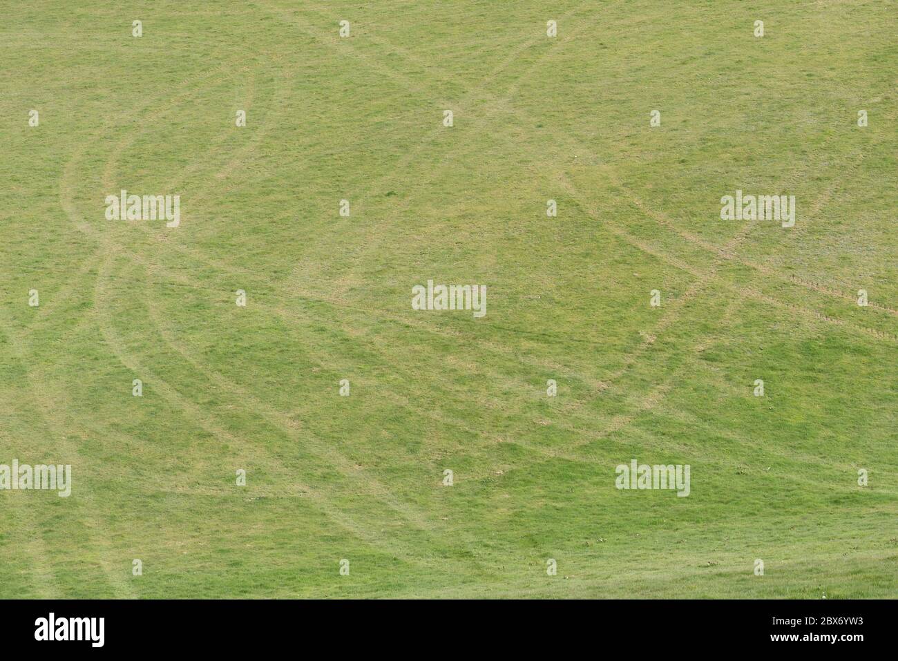 Multiple tractor tracks forming crossover patterns of parallel lines ...