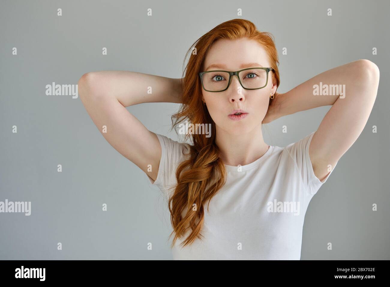 Woman raising eyebrow hi-res stock photography and images - Alamy