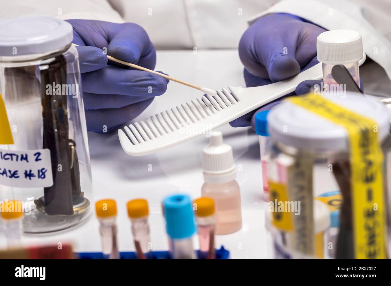 Specialized police take DNA sample from murder victim, conceptual image ...