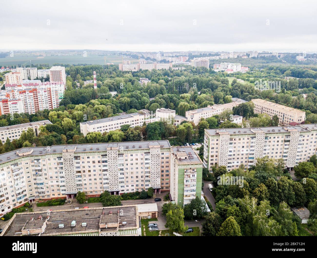 Aerial view of town with socialist soviet panel building at cloudy day ...