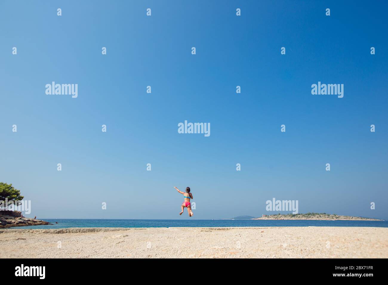 Child girl lake jump hi-res stock photography and images - Alamy
