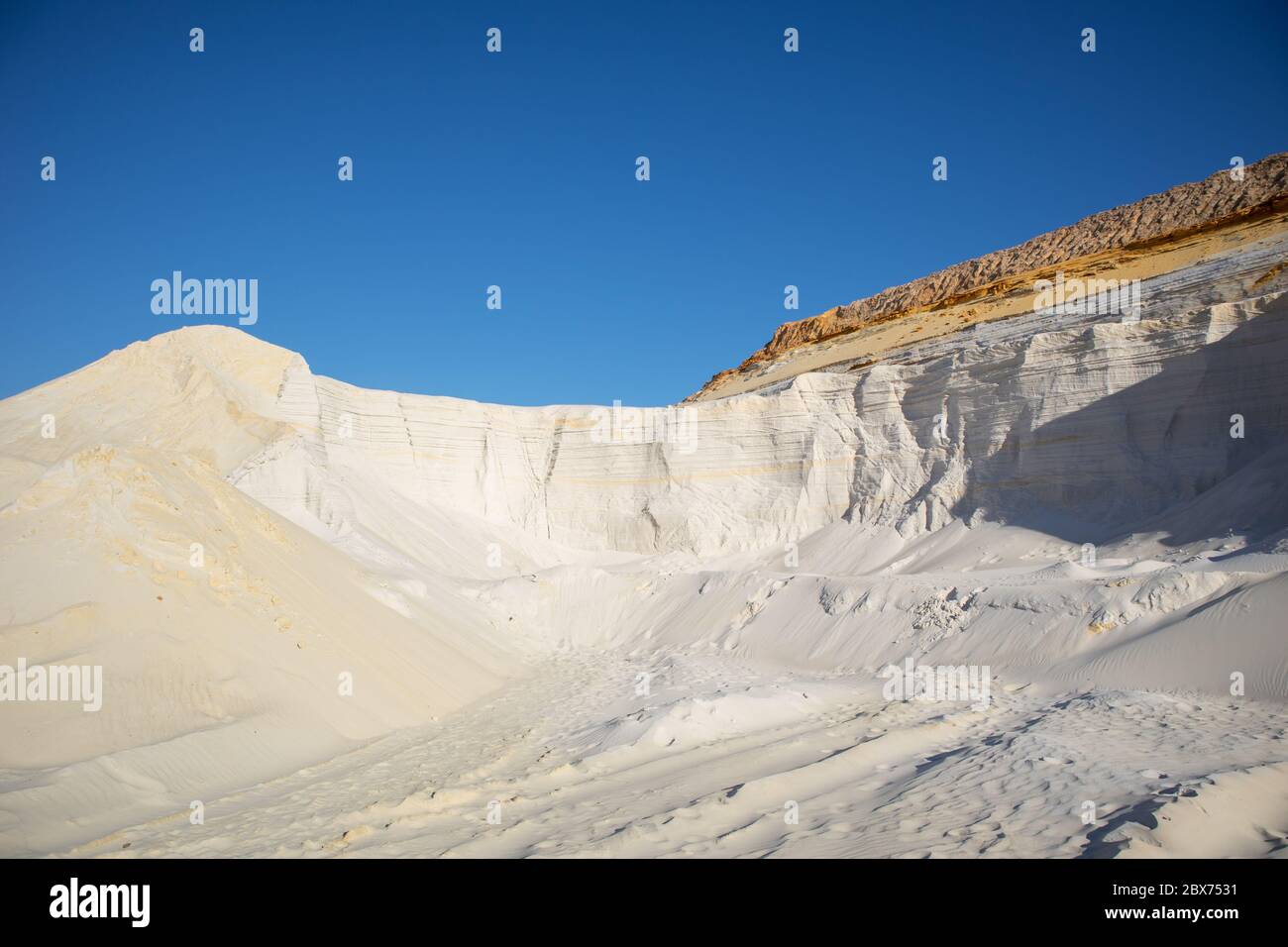 White sand and blue sky. Embossed sand mountains of white sands. Desert ...