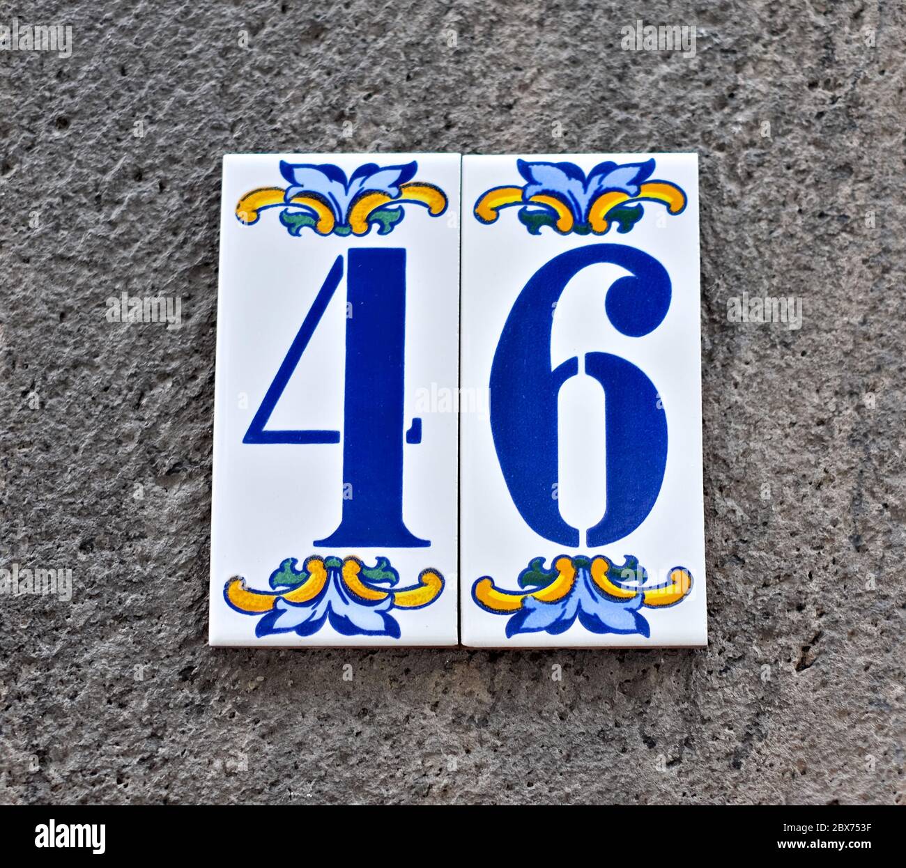 46, number forty-six, decorative tilework on gray surface Stock Photo ...
