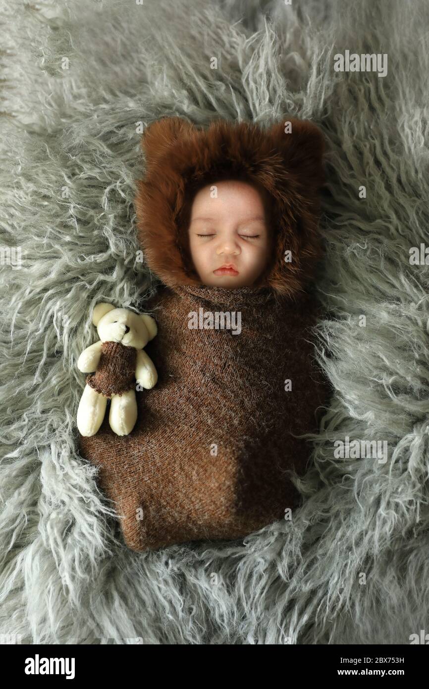 Adorable and Creative Sleeping Styled Newborn Portraits Stock Photo - Alamy
