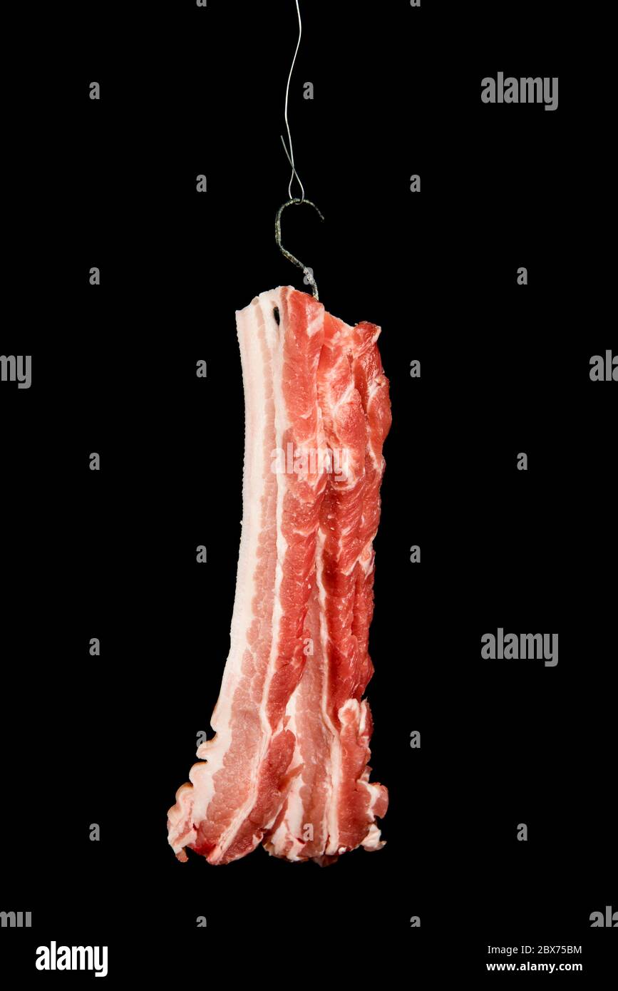 bacon slices hanging on a hook Stock Photo - Alamy