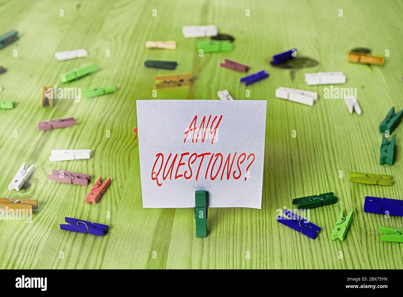 Writing note showing Any Questions Question. Business concept for ...