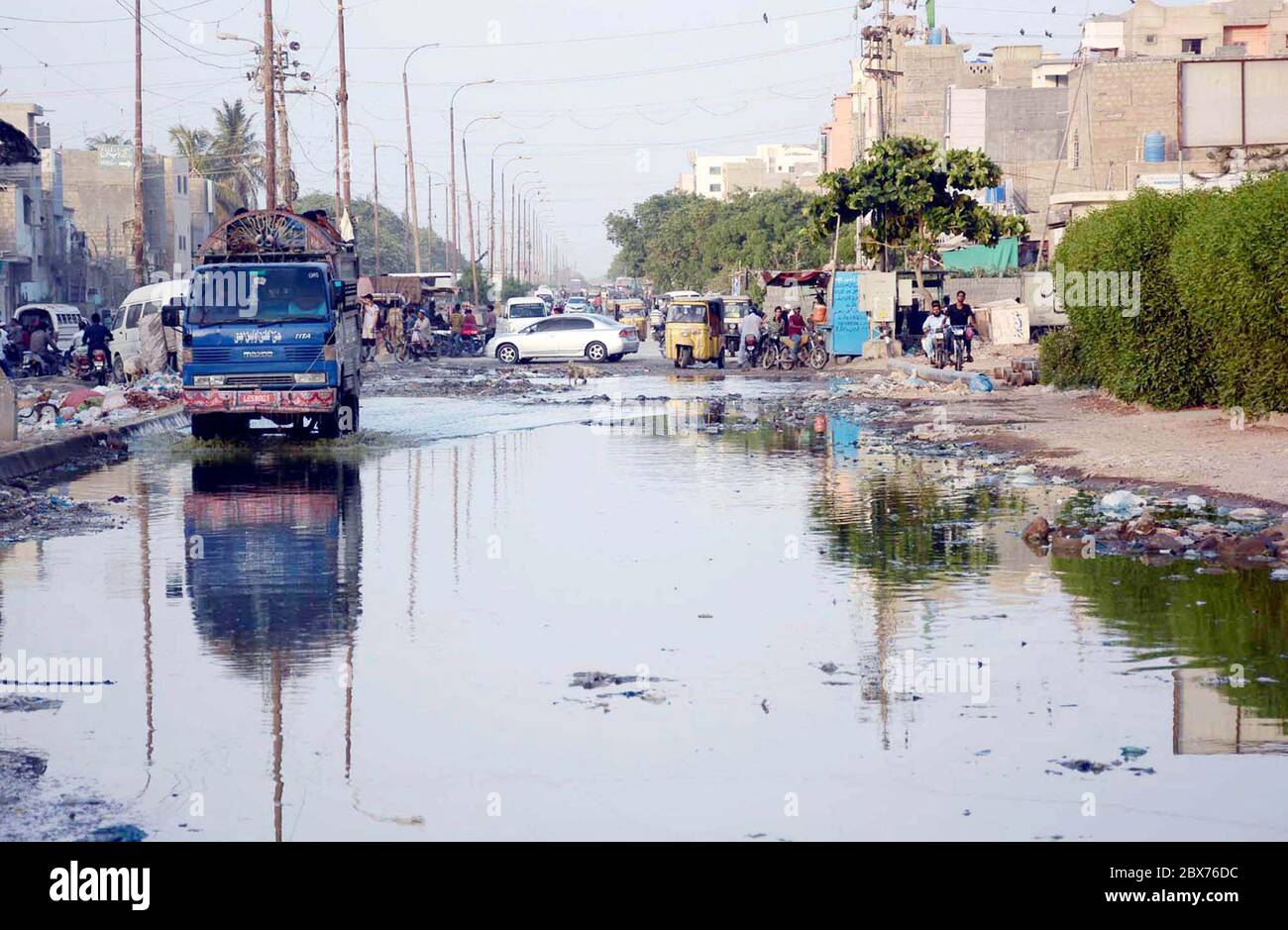 Inundated road by overflowing sewerage water creating problems for ...