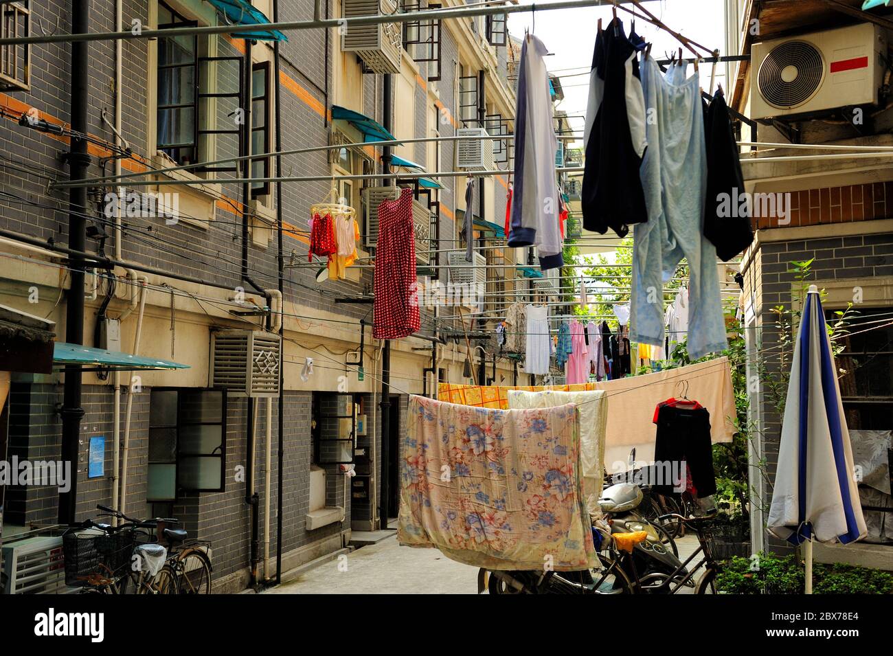 Washed clothes drying outdoor in old street in Shanghai, China Stock ...