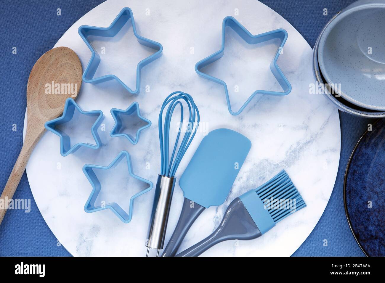 Baking utensils and bowls, top view on marble background. Blue tones ...