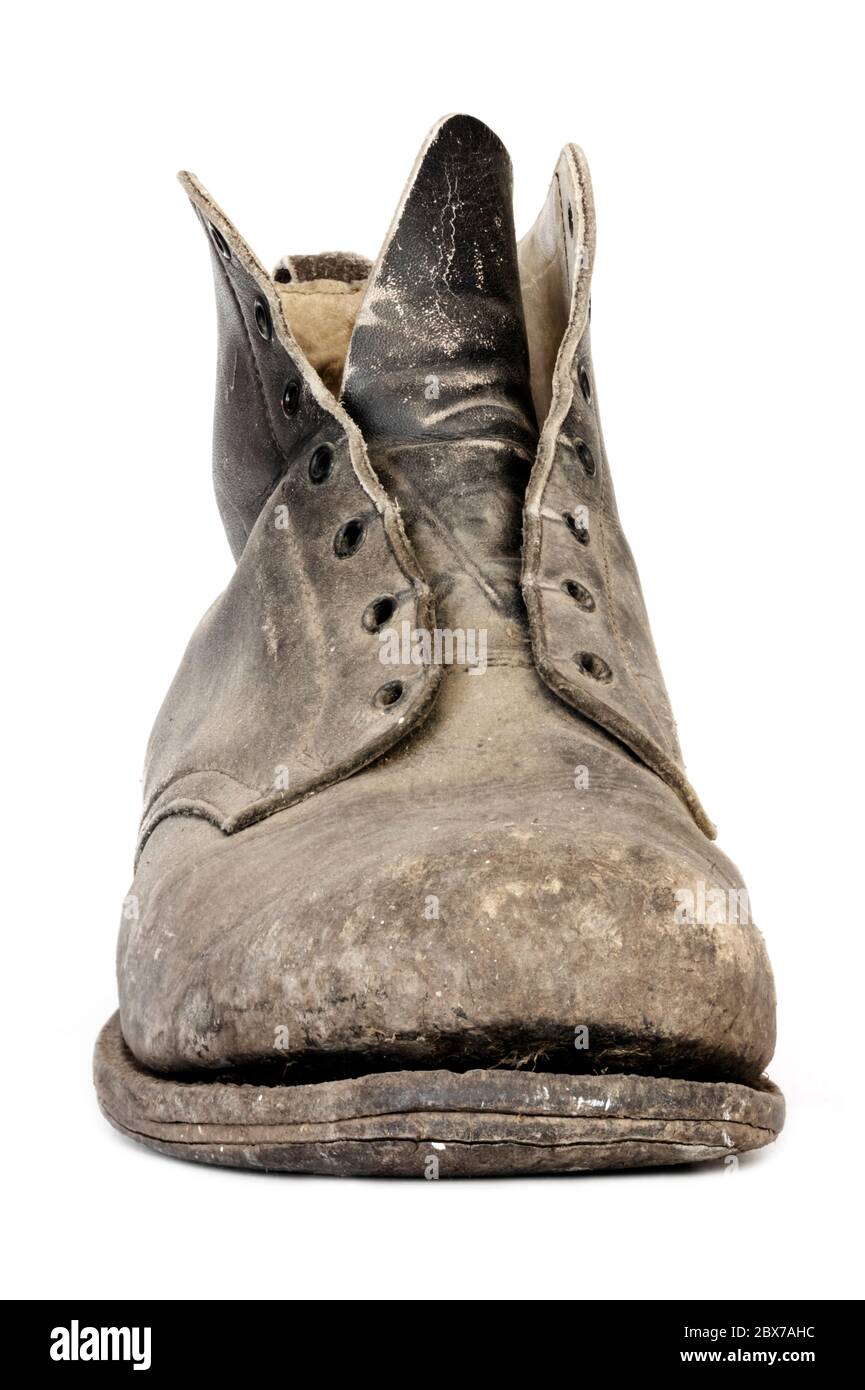 Old worn boot, isolated on white, front view Stock Photo - Alamy