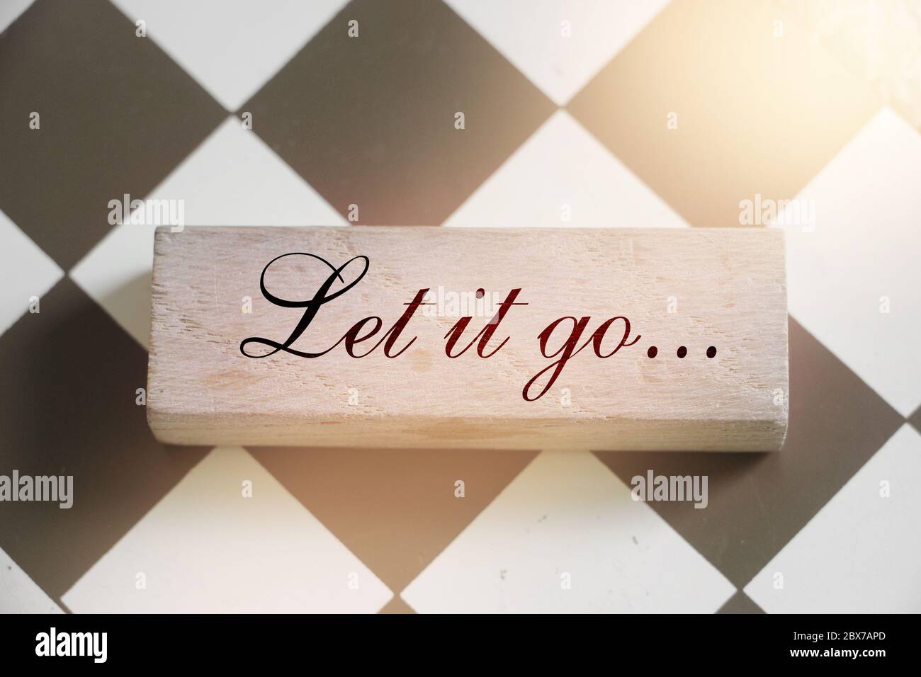 Let It Go wooden sign with a chess on background. Phylosophy ...