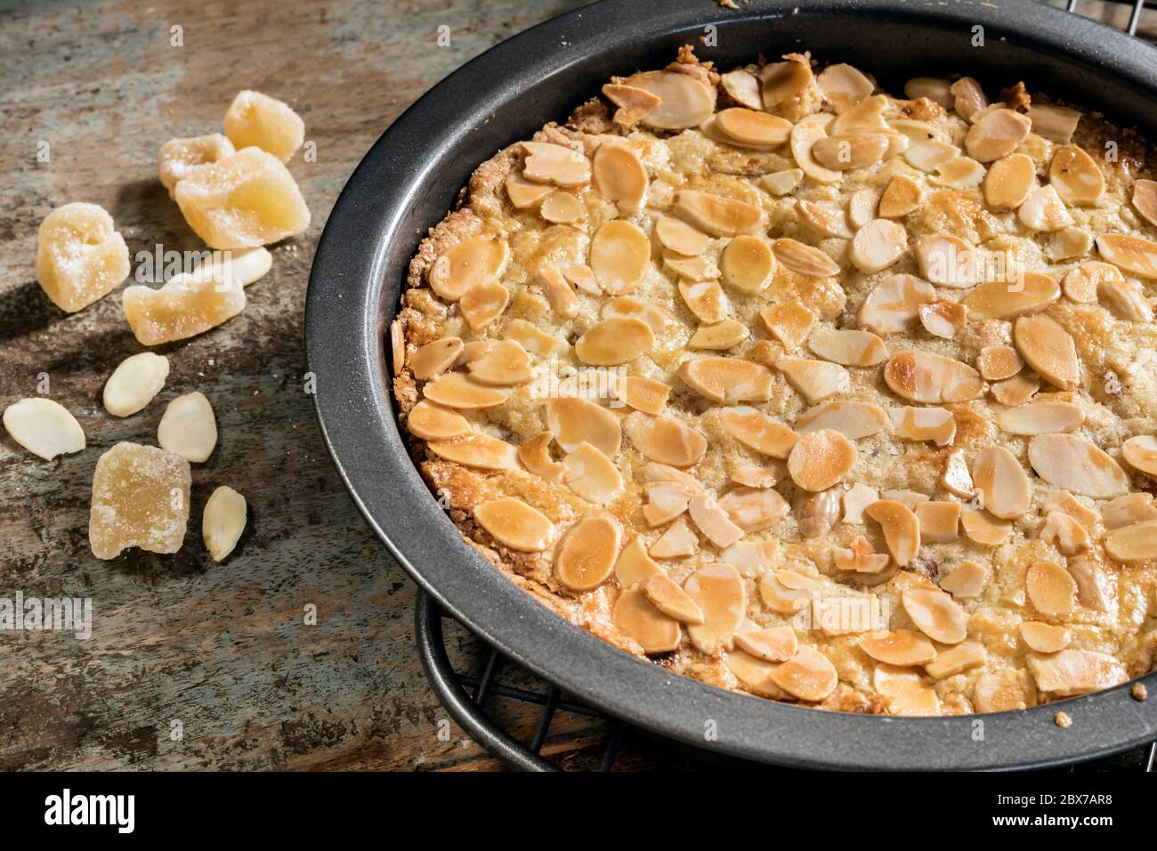 Dutch ginger cake, in pan on cooling rack. With crystalized ginger and ...
