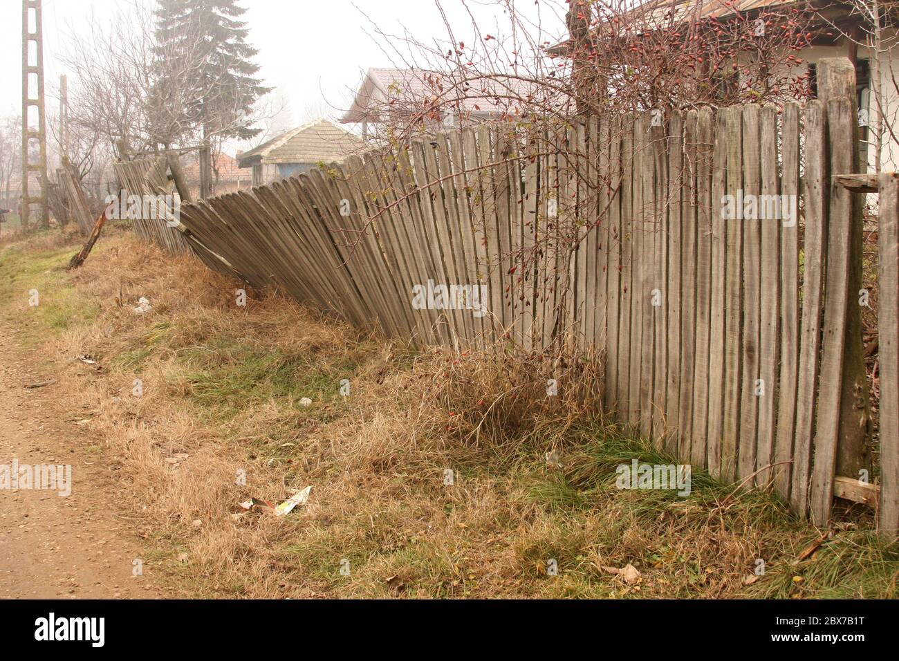 Abandoned small house with fence falling apart in Silistea Gumesti ...