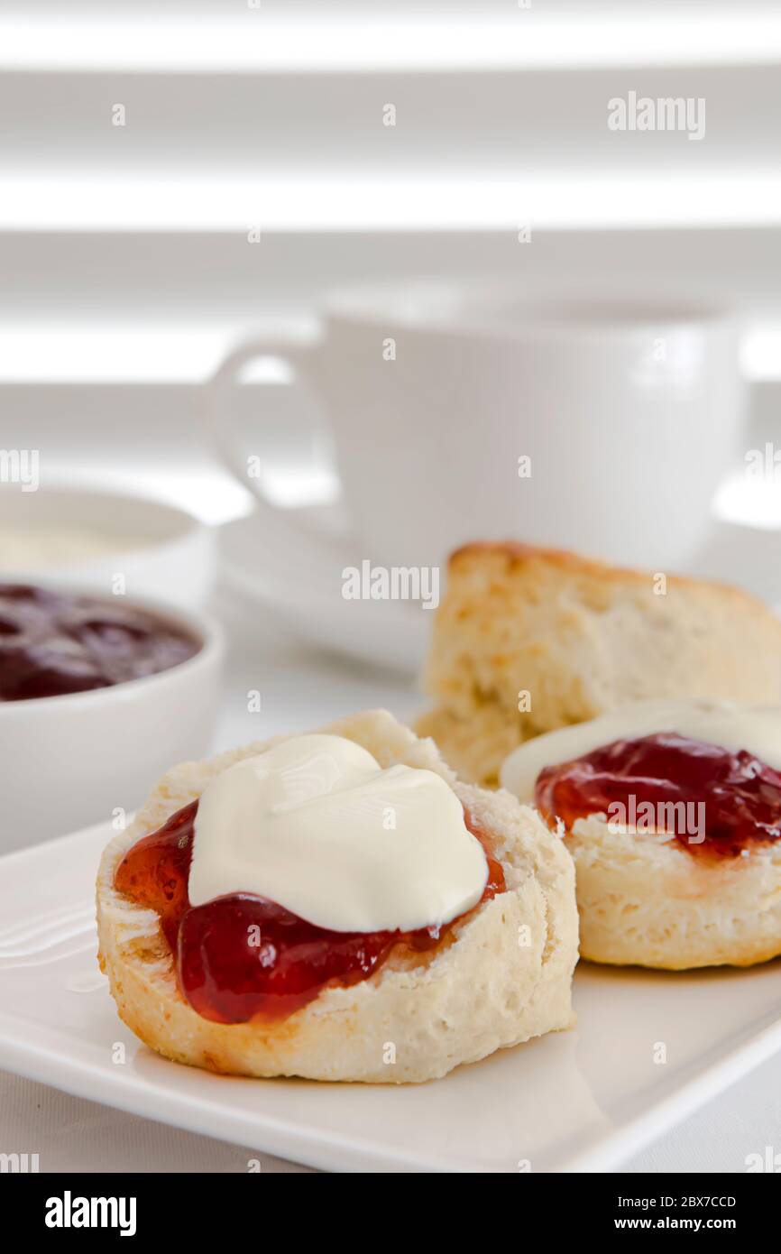 Scones with strawberry jam and cream. Traditional English or Devonshire ...