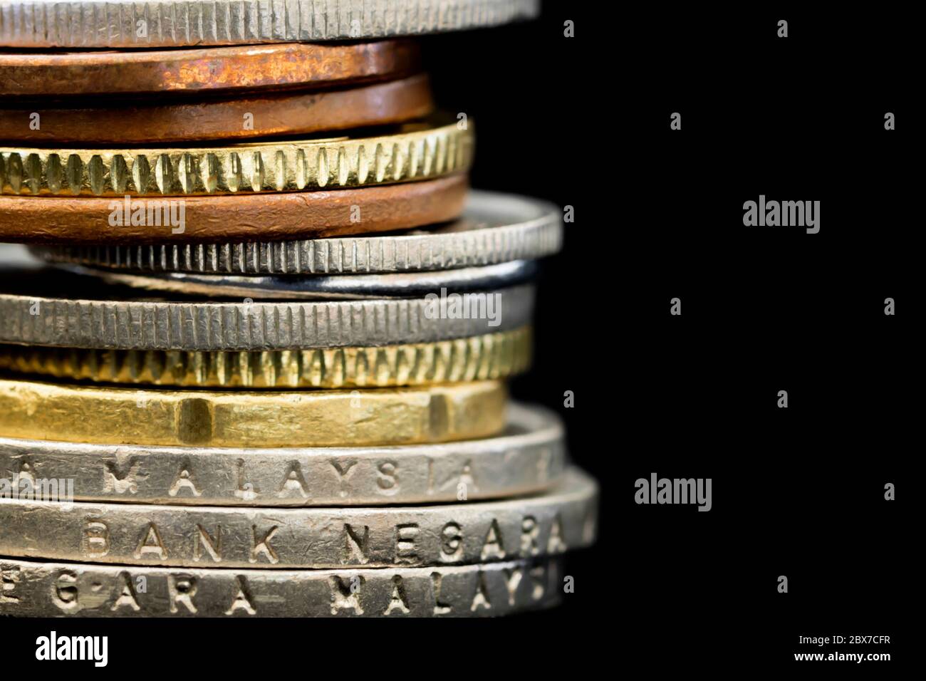Stack of Malaysian coins over black background Stock Photo - Alamy