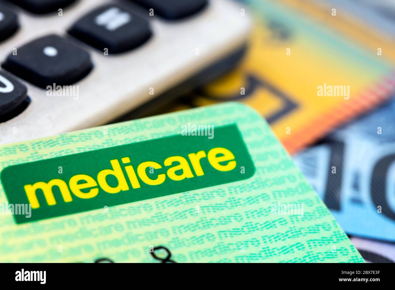 Australian Medicare card with calculator and cash background Stock ...