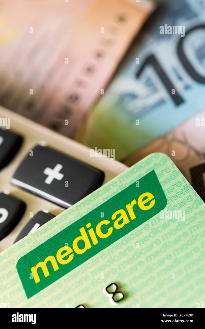 Australian Medicare card with calculator and cash background Stock ...