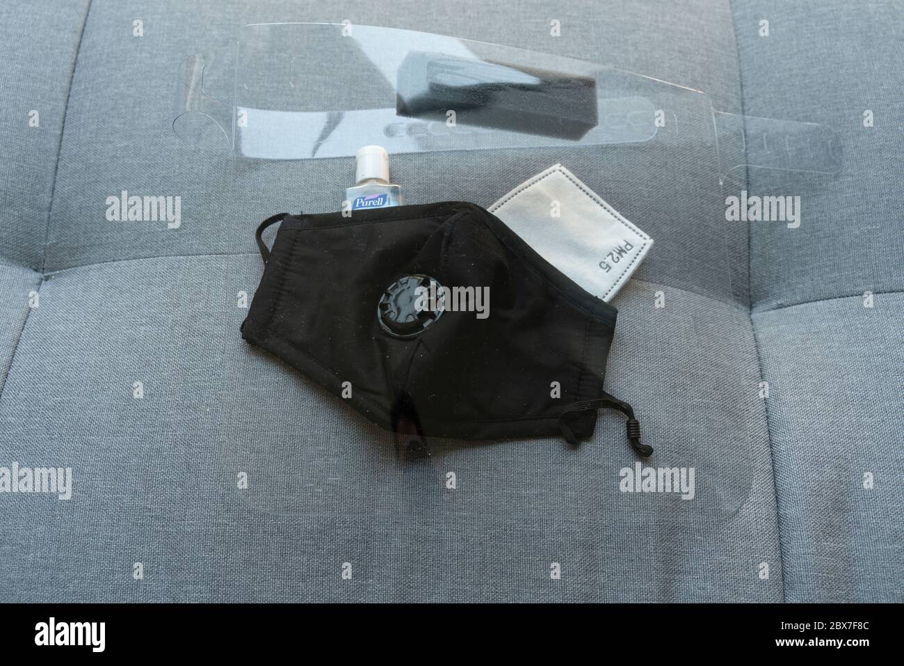 Black face mask, alcohol gel and mask ready for the new reality in the ...