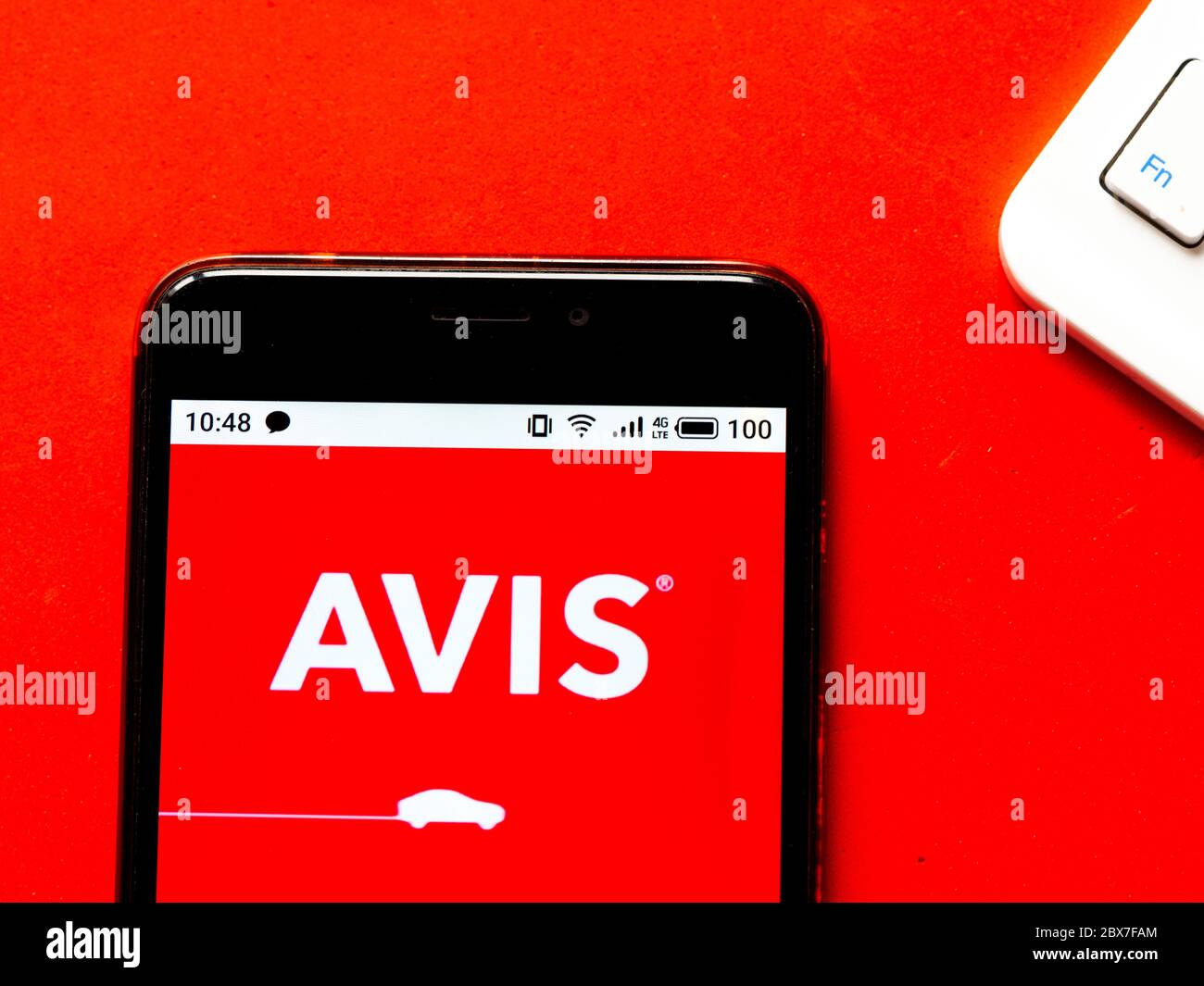 In this photo illustration an Avis logo is seen displayed on a ...