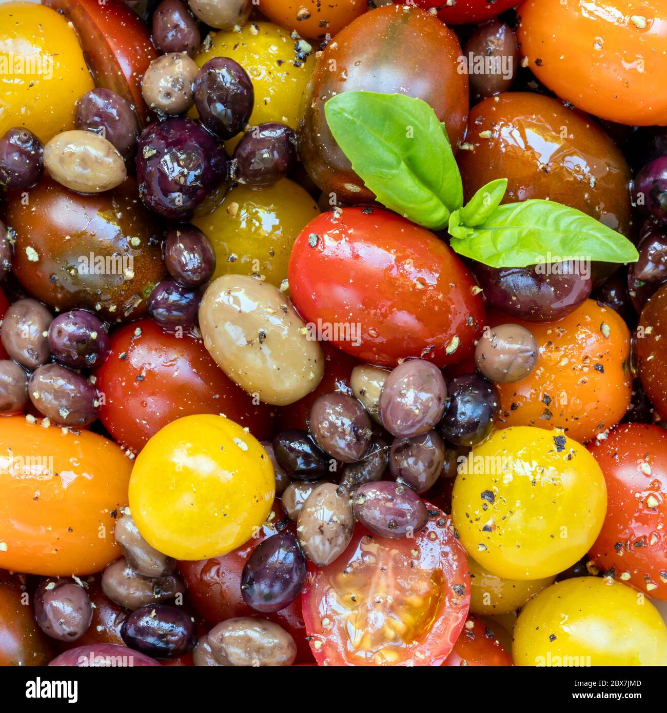 Tomato and olive salad with basil Stock Photo - Alamy