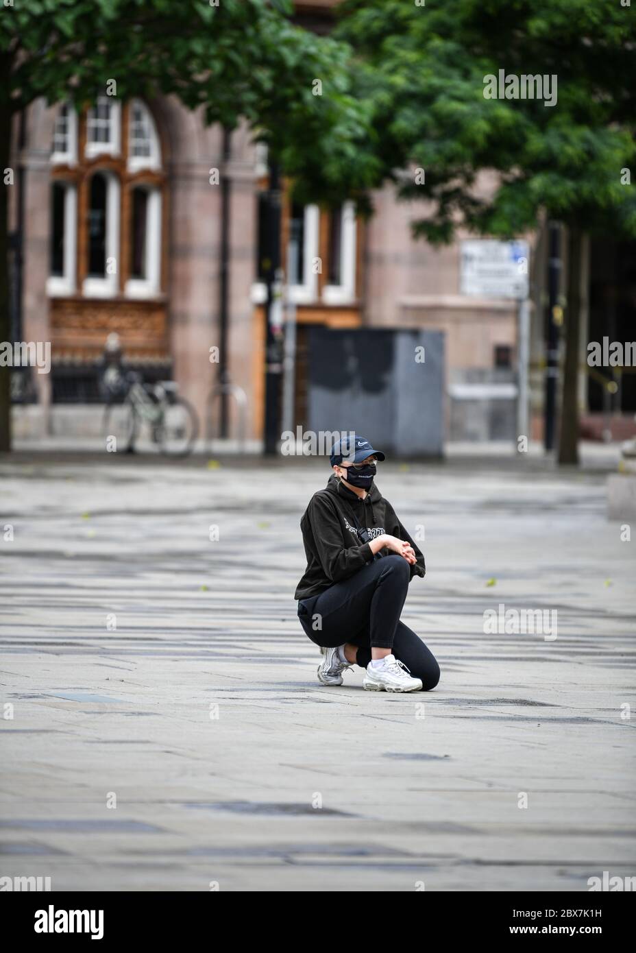 A lone protester takes a knee during the demonstration.Hundreds of ...