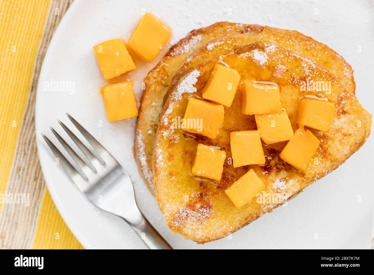 French toast with fresh mango and syrup. Top View Stock Photo - Alamy