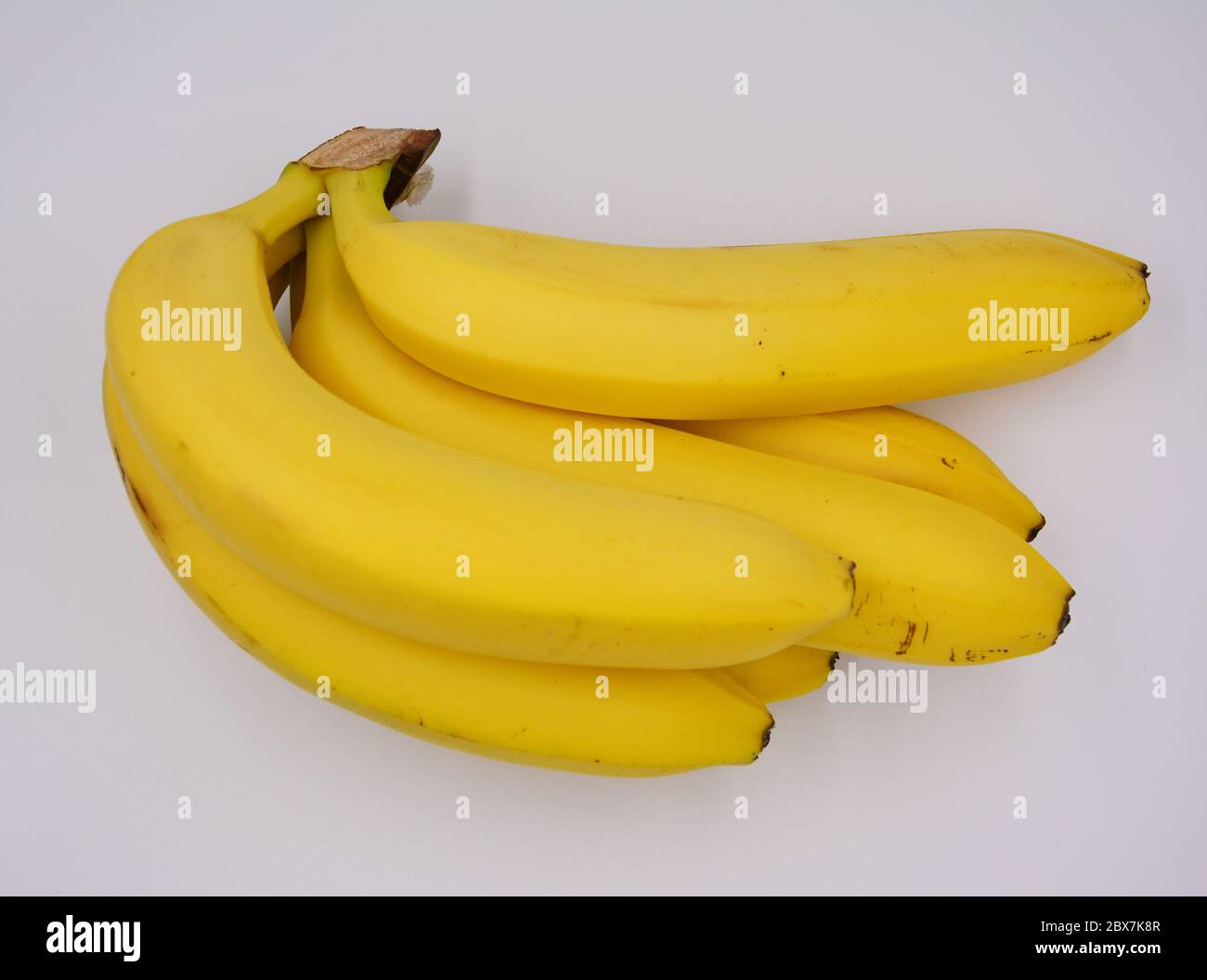 Yellow ripe bananas on the white background Stock Photo - Alamy