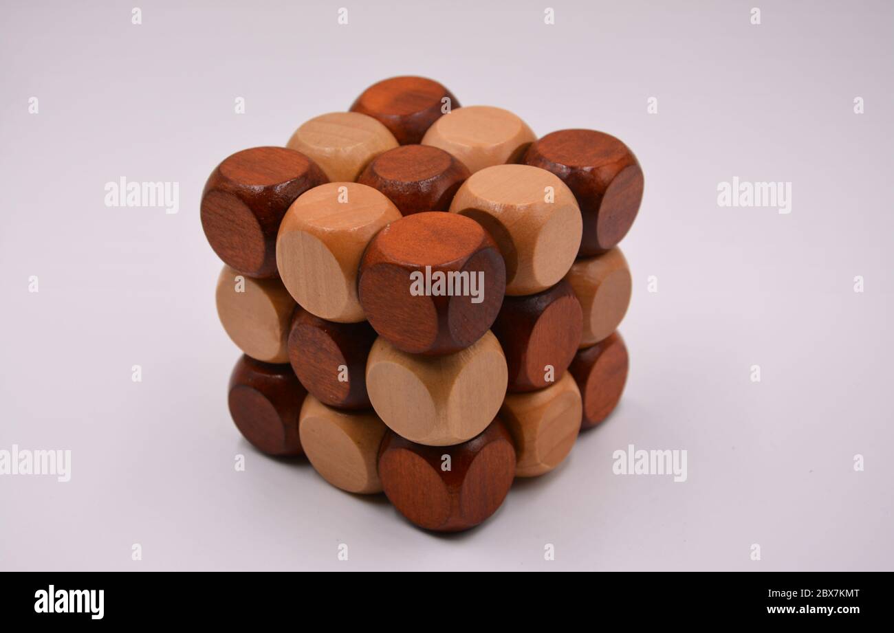 The brown magic cubes made of wood with white background Stock Photo ...