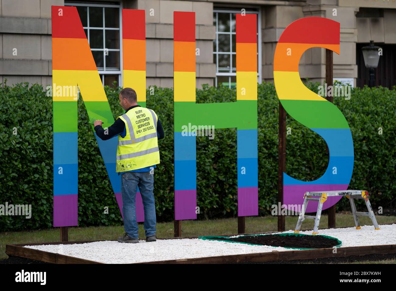 Bury, UK. 5th June, 2020. Picture shows an NHS sign being painted in ...