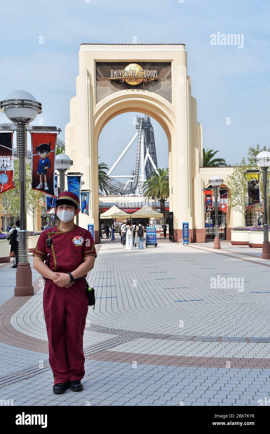 A staff member stands in front of the gate at the Universal Studios ...