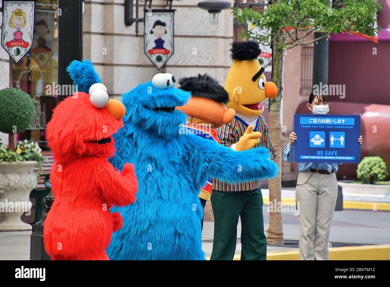 A staff member stands in front of the gate at the Universal Studios ...