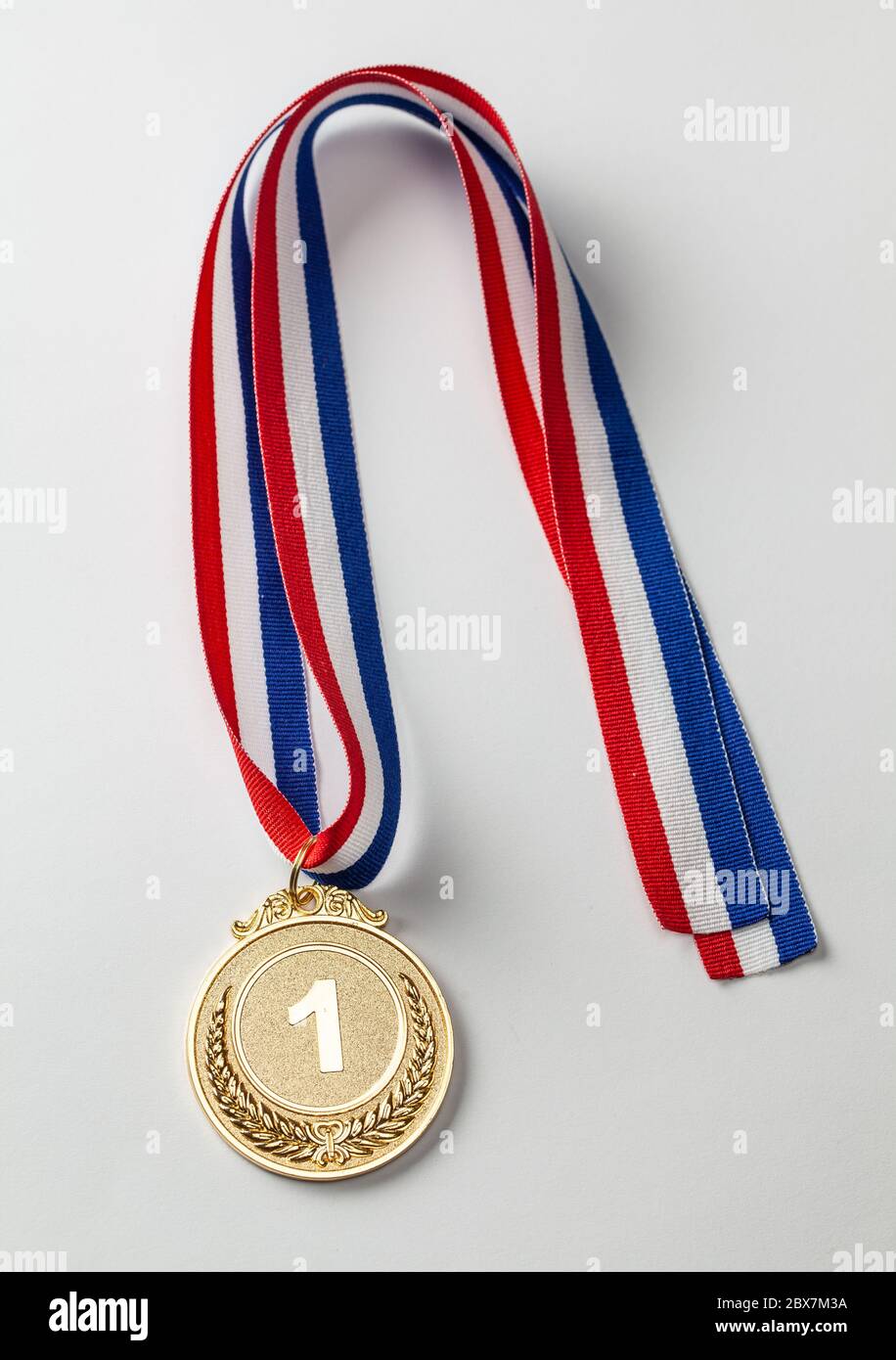 Gold medal. First place award with ribbon Stock Photo - Alamy