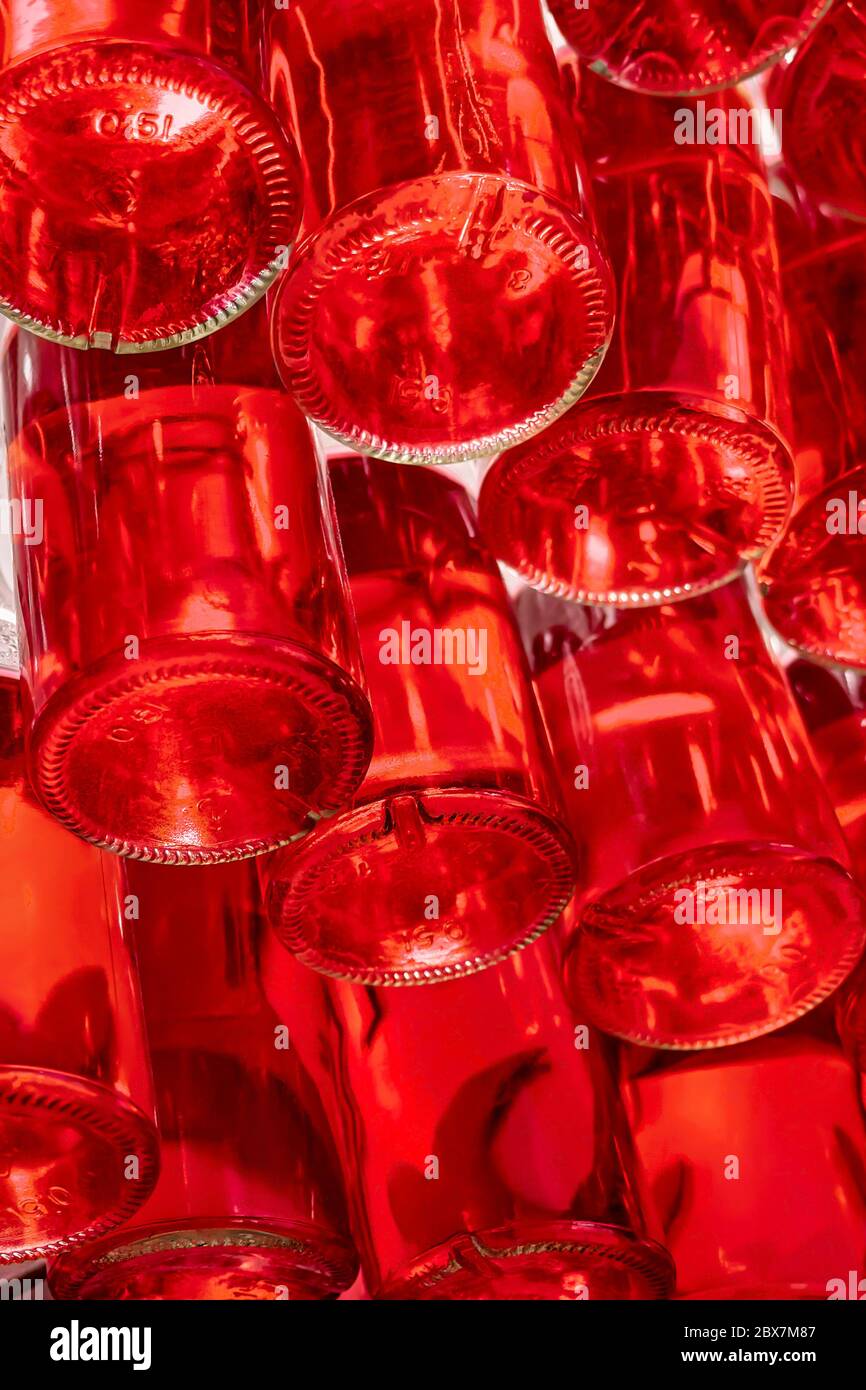 Drinks bottled and stored in stack. Bottles of red beverage stored on ...