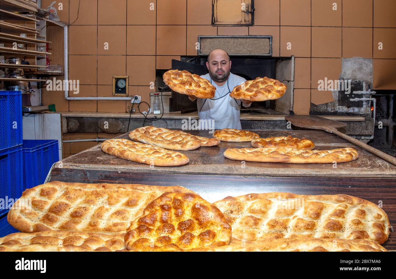 A baker making Turkish pita bread. Bakery,Turkish pita bread making ...